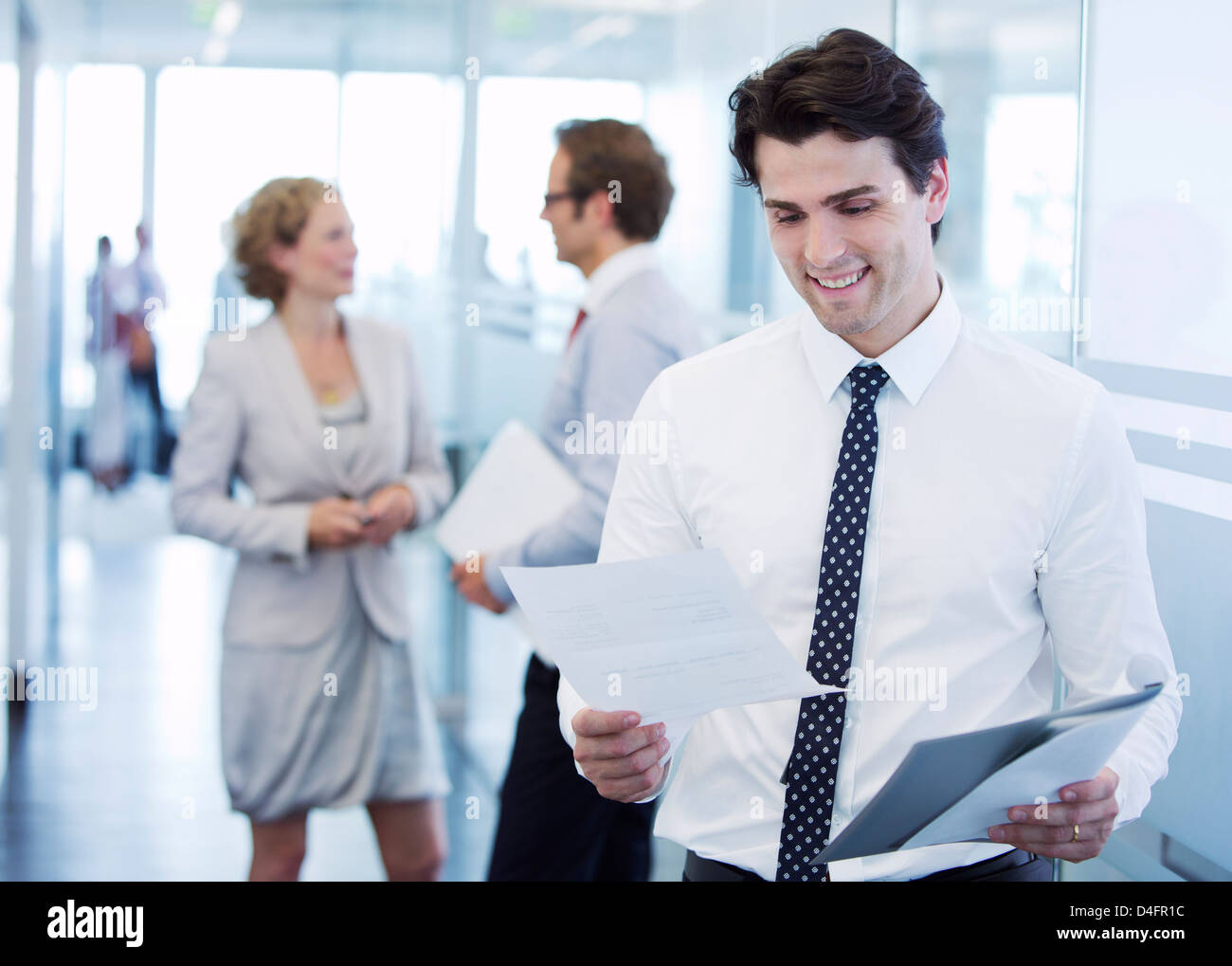 Female office worker reading hi-res stock photography and images - Alamy