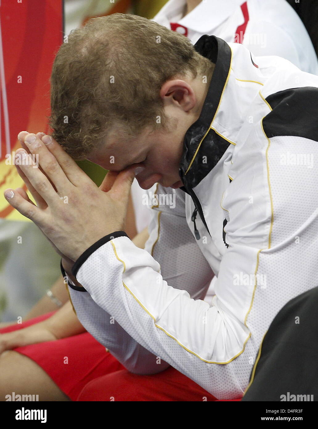 Fabian Hambuechen of Germany cries after the Men's Horizontal Bar Final ...