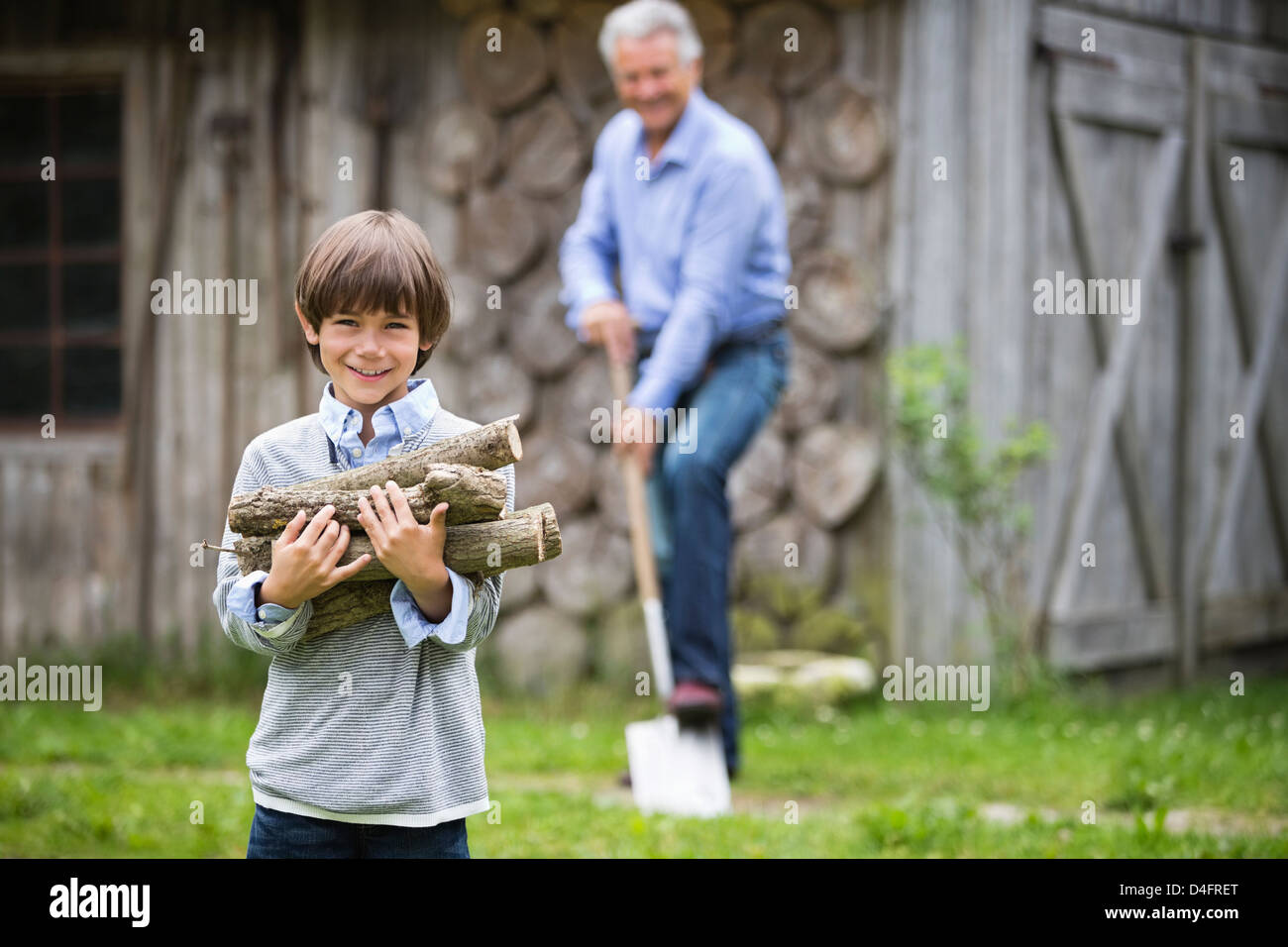 Young Man Carrying Firewood High Resolution Stock Photography and ...