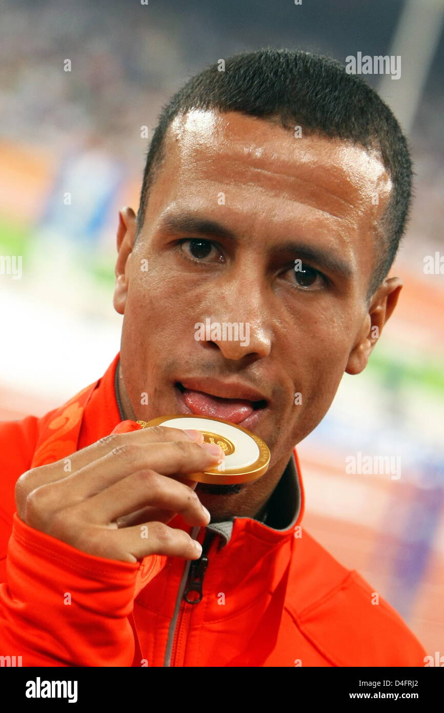 Gold medalist Rashid Ramzi of Bahrain presents his medal during the ...