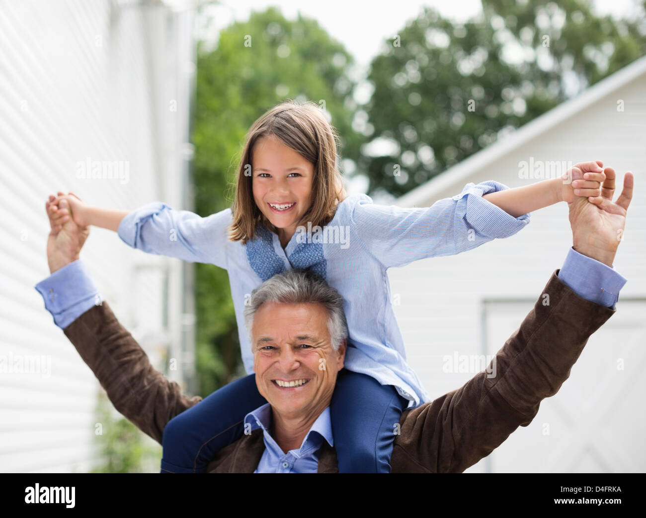 Children riding on shoulders hi-res stock photography and images - Alamy