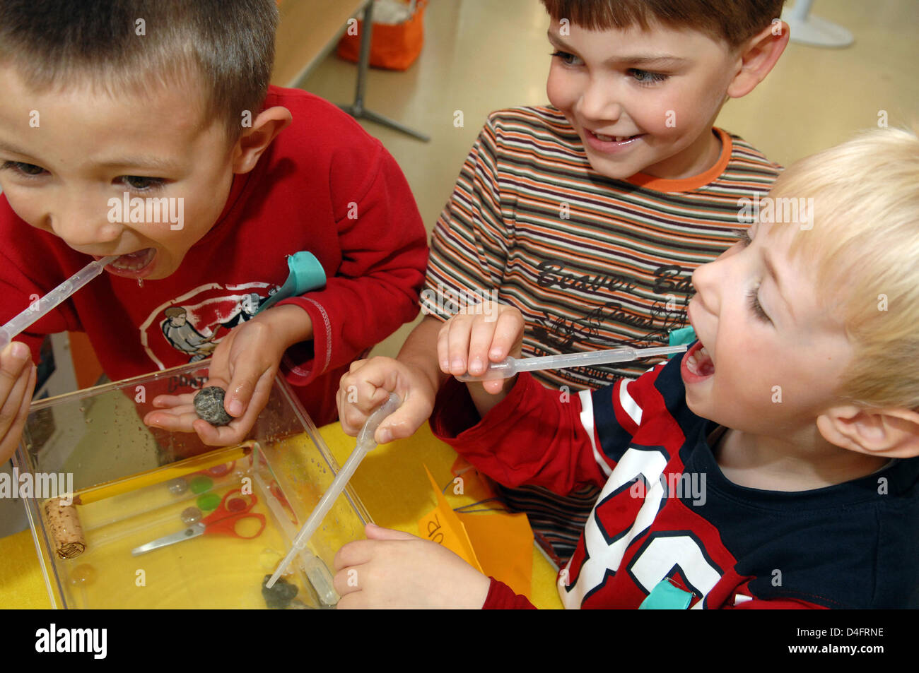 Jonas, Oli and Janeck play with water and syringes at the 'German ...