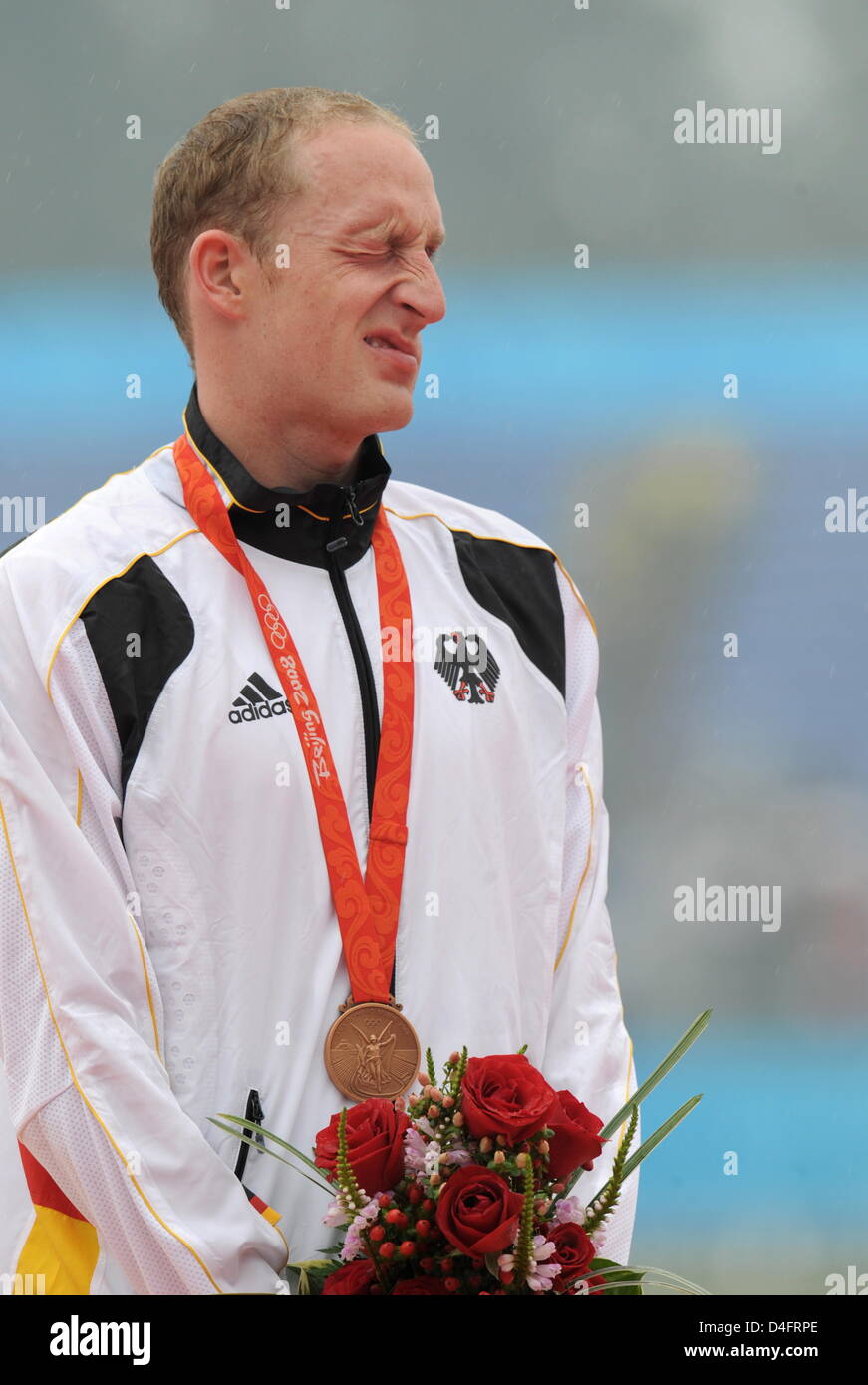 Thomas Lurz of Germany celebrates with his bronze medal during the ...