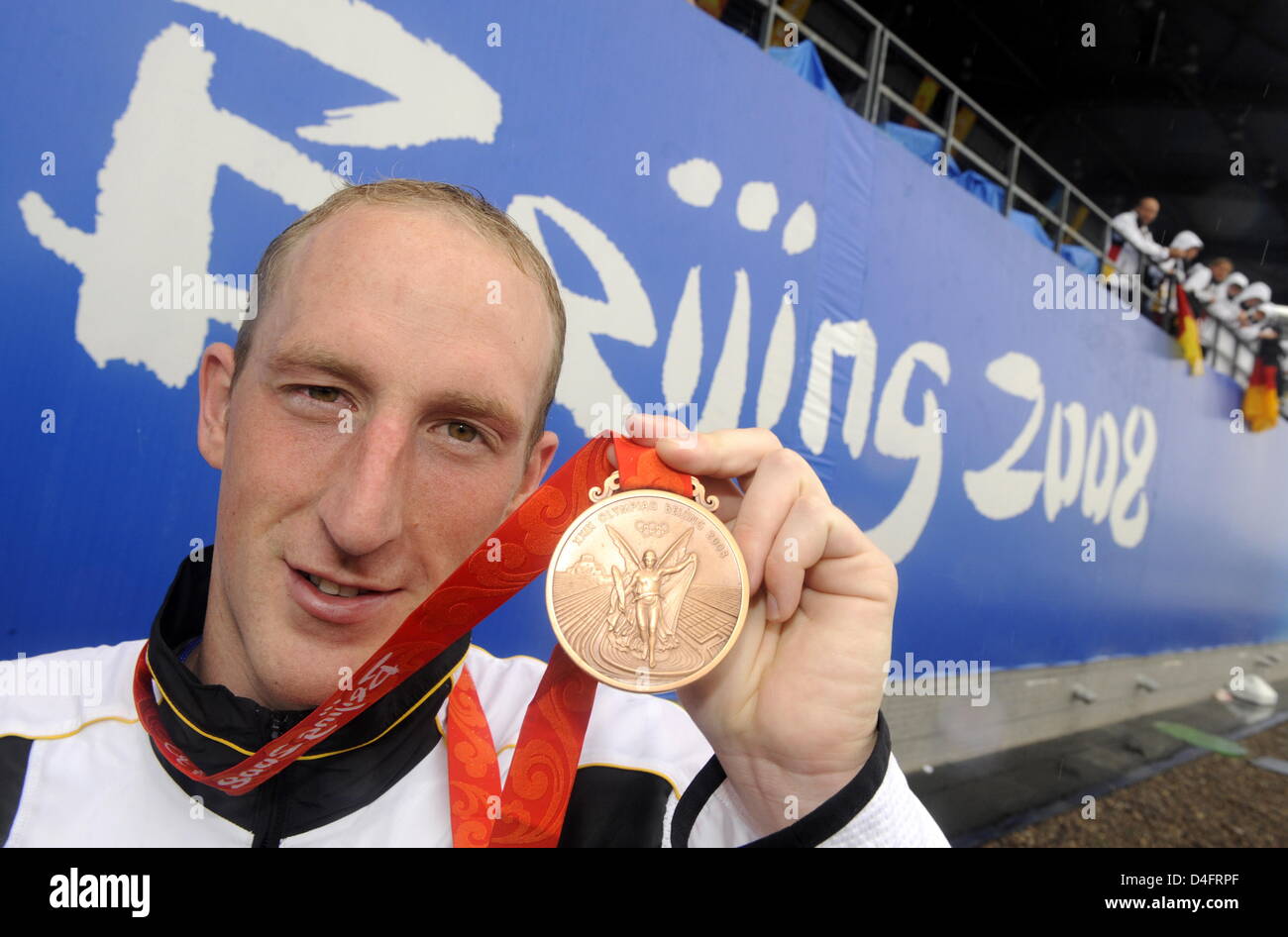 Thomas Lurz of Germany celebrates with his bronze medal after the Men's ...
