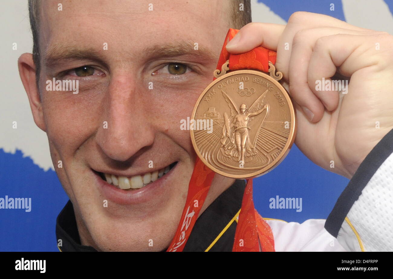 Thomas Lurz of Germany celebrates with his bronze medal after the Men's ...