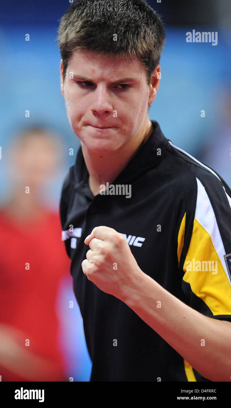 Dimitrij Ovtcharov (black) of Germany reacts with clenched fist to ...