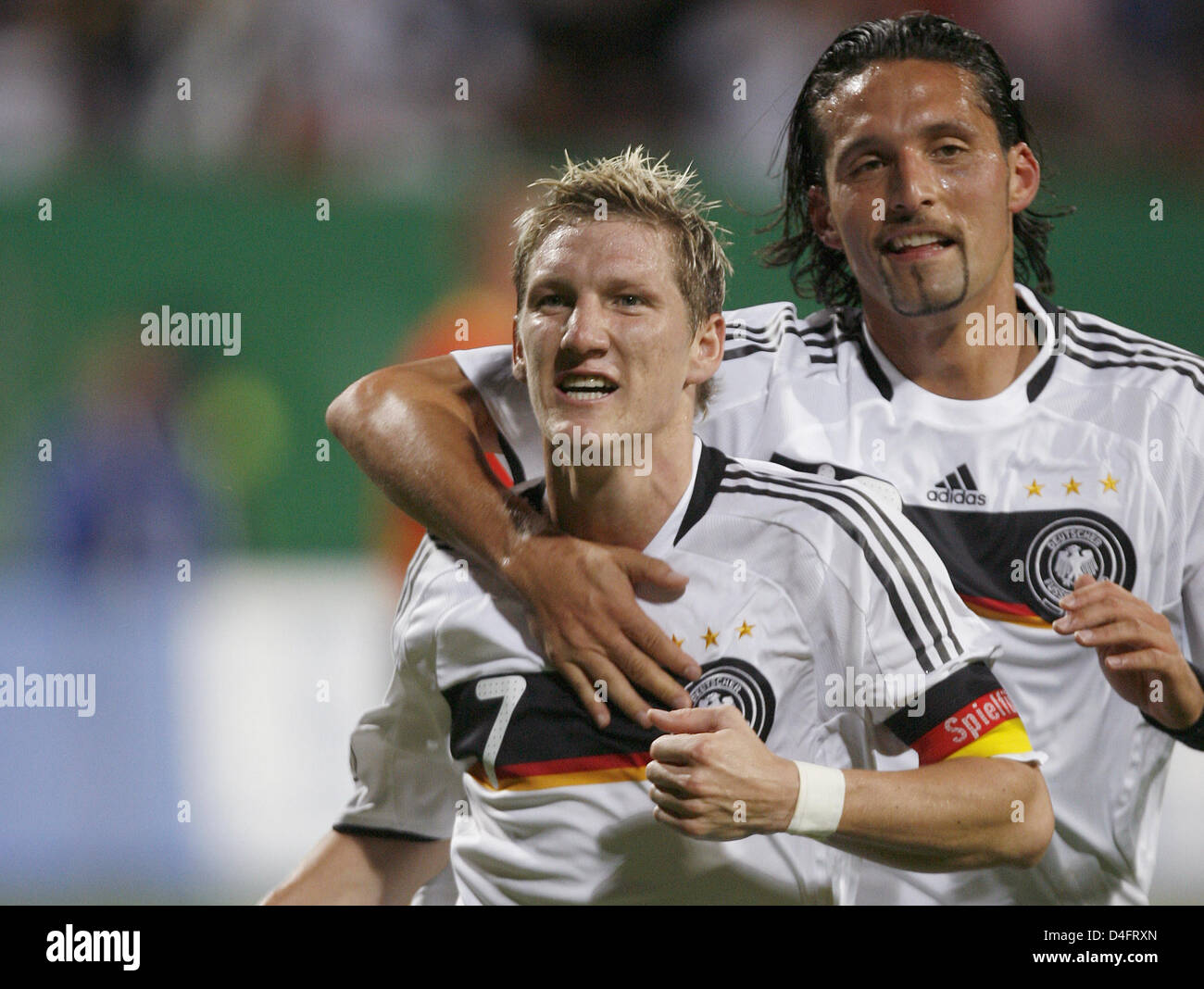German Bastian Schweinsteiger (L) and Kevin Kuranyi celebrate ...