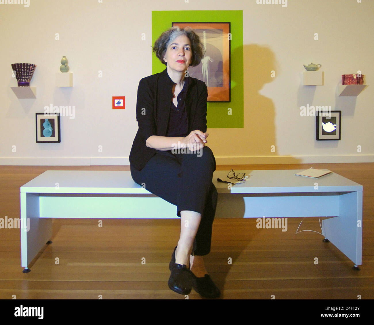 US artist Barbara Bloom captured with some of the exhibits of the ...