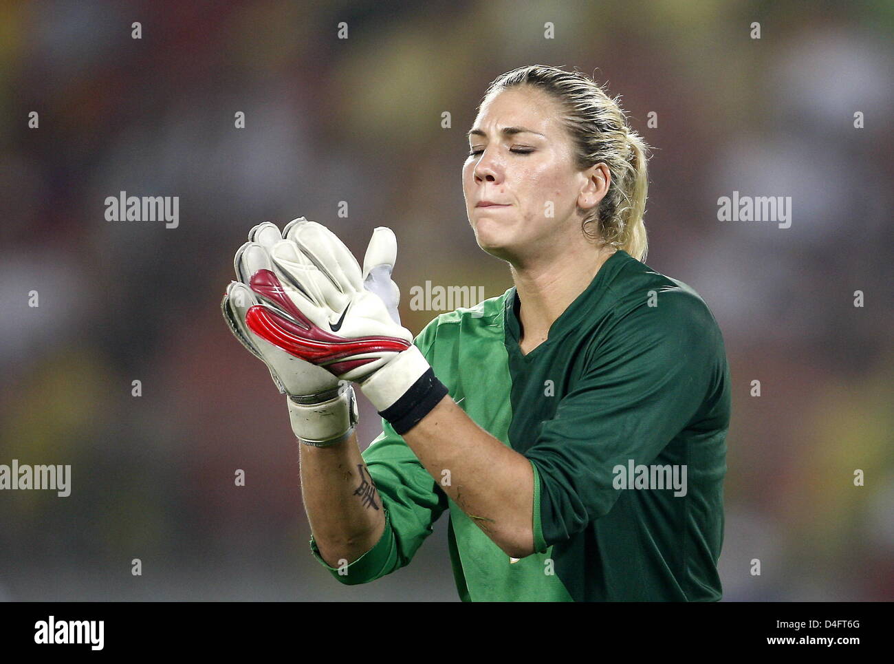 Goalkeeper Hope Solo of the USA reatcs during the Women's football gold ...
