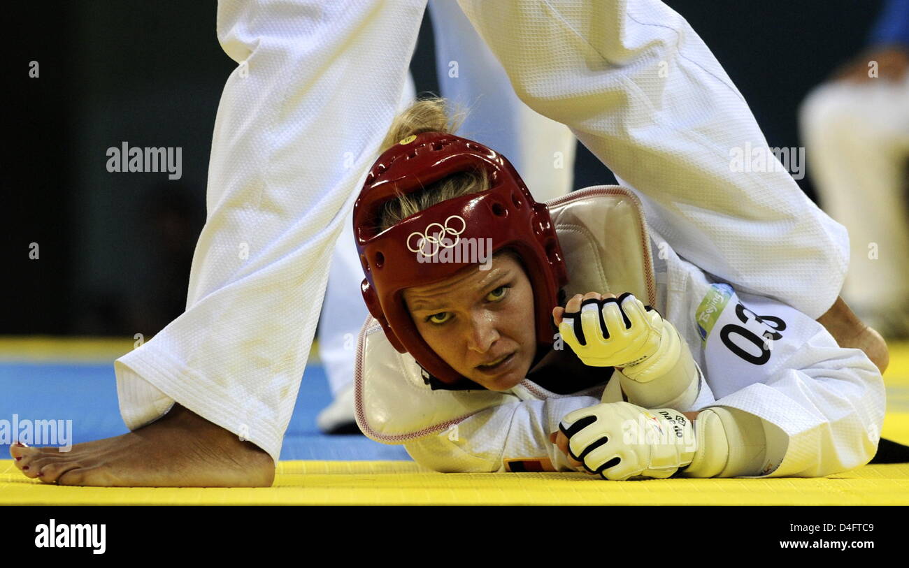 Helena Fromm of Germany lies on the ground during her fight against ...