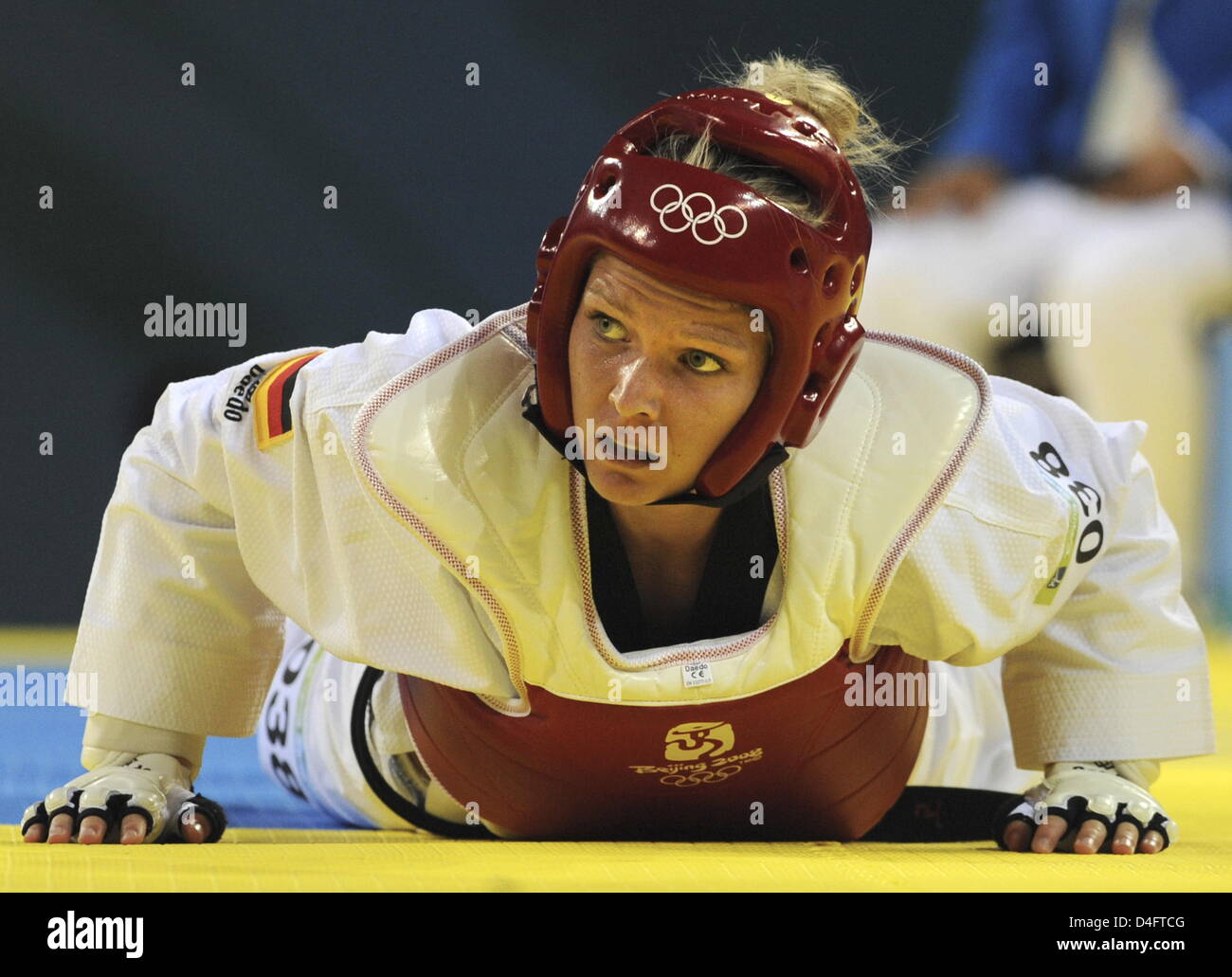 Helena Fromm of Germany lies on the ground during her fight against ...