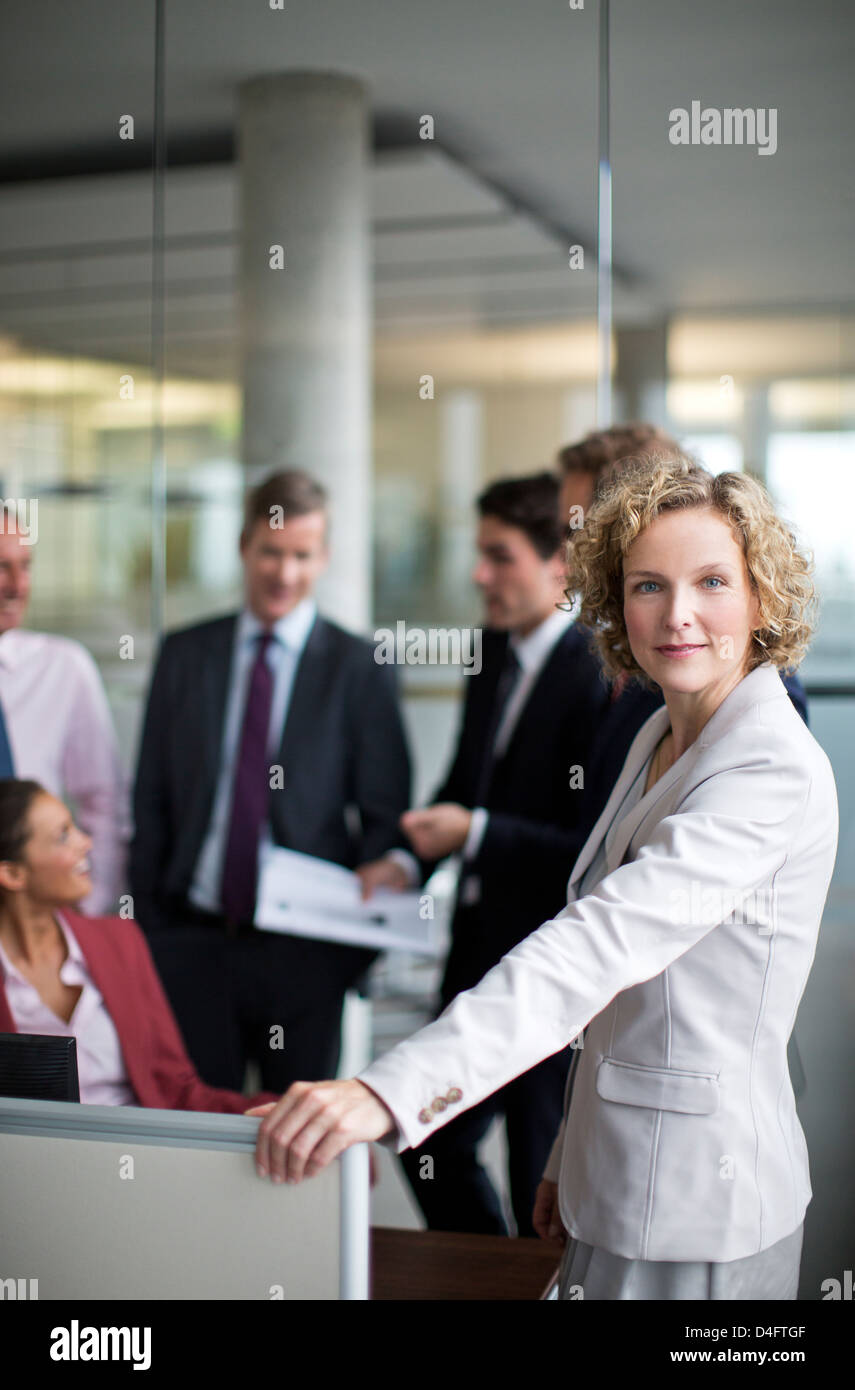 Businesswoman standing in cubicle hi-res stock photography and images ...