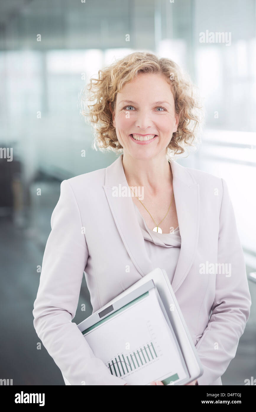 Businesswoman smiling in office hallway Stock Photo - Alamy Businesswoman smiling in office hallway Stock Photo - Alamy