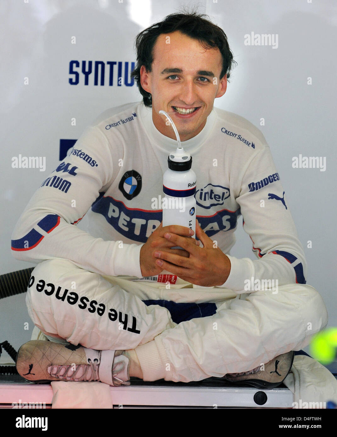 Polish Formula One driver Robert Kubica of BMW Sauber smiles in the ...