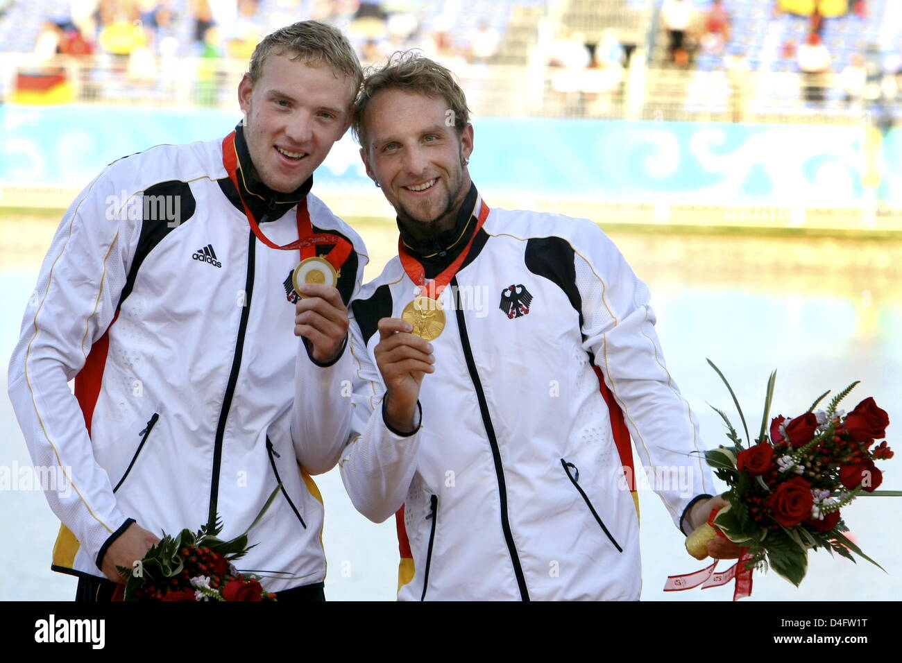 Andreas Ihle (R) and Martin Hollstein of Germany show their Gold Medals ...