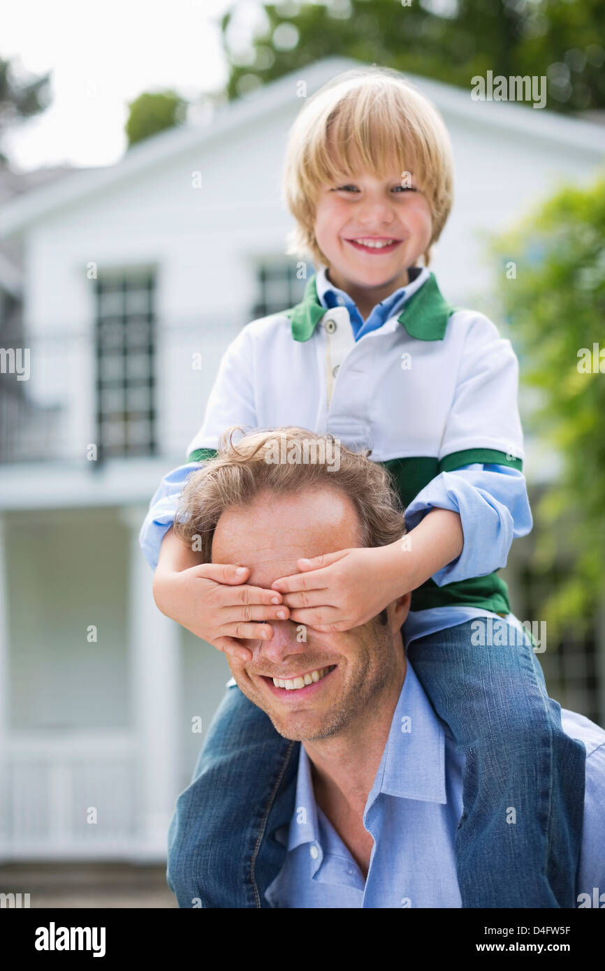 Son covering fathers eyes hi-res stock photography and images - Alamy