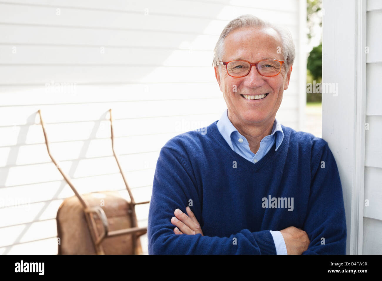 Man smiling outside house Stock Photo - Alamy