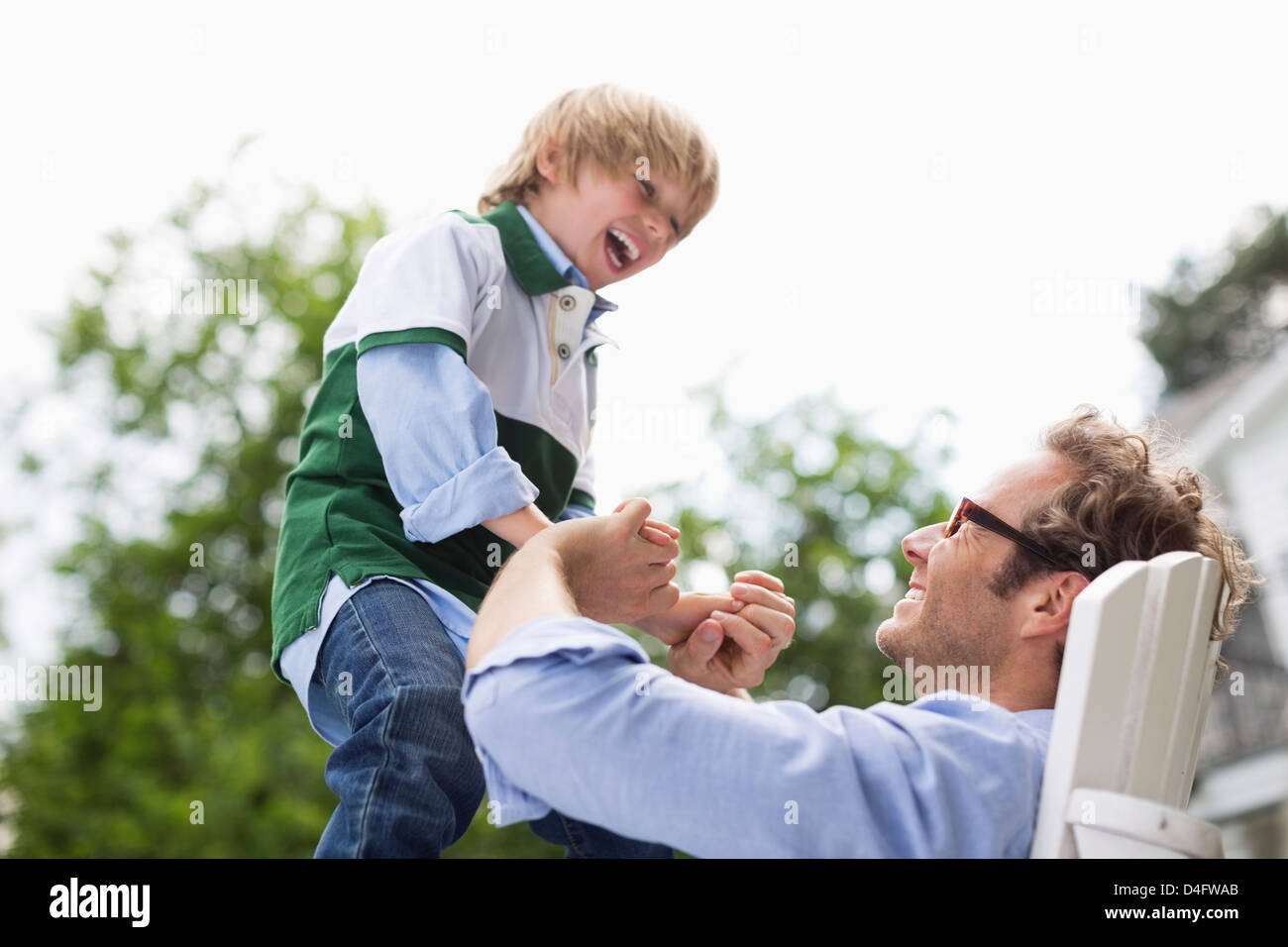 Father and son playing outdoors Stock Photo - Alamy Father and son playing outdoors Stock Photo - Alamy
