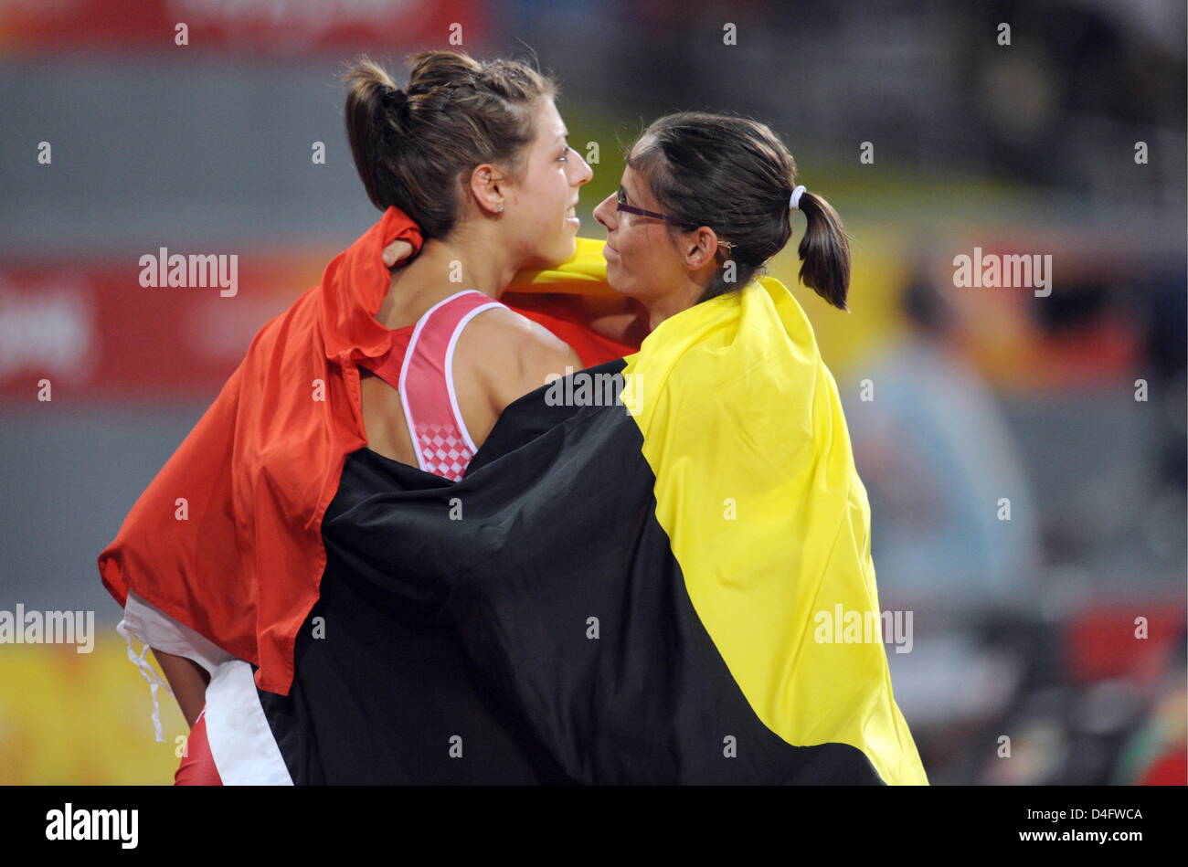 Tia Hellebaut of Belgium (R) hugs secondplaced Blanka Vlasic of Croacia ...
