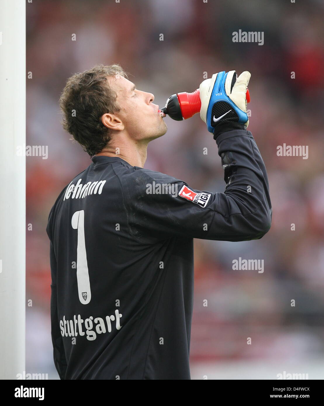 VfB Stuttgart goalkeeper Jens Lehmann takes a sip from his drinking ...