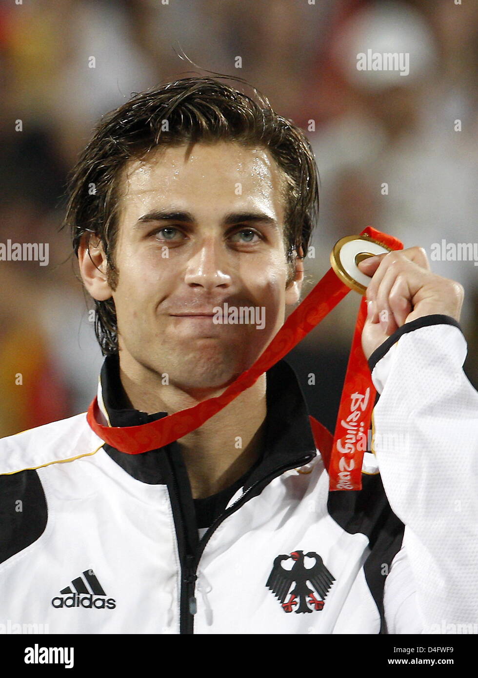 Christopher Zeller of Germany shows his gold medal during the medal ...