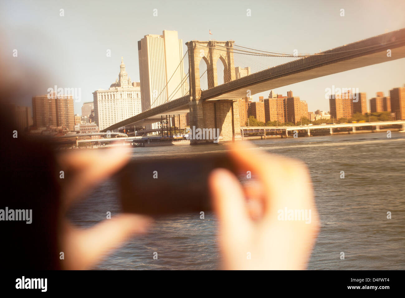 Hands taking picture of urban bridge and cityscape Stock Photo - Alamy