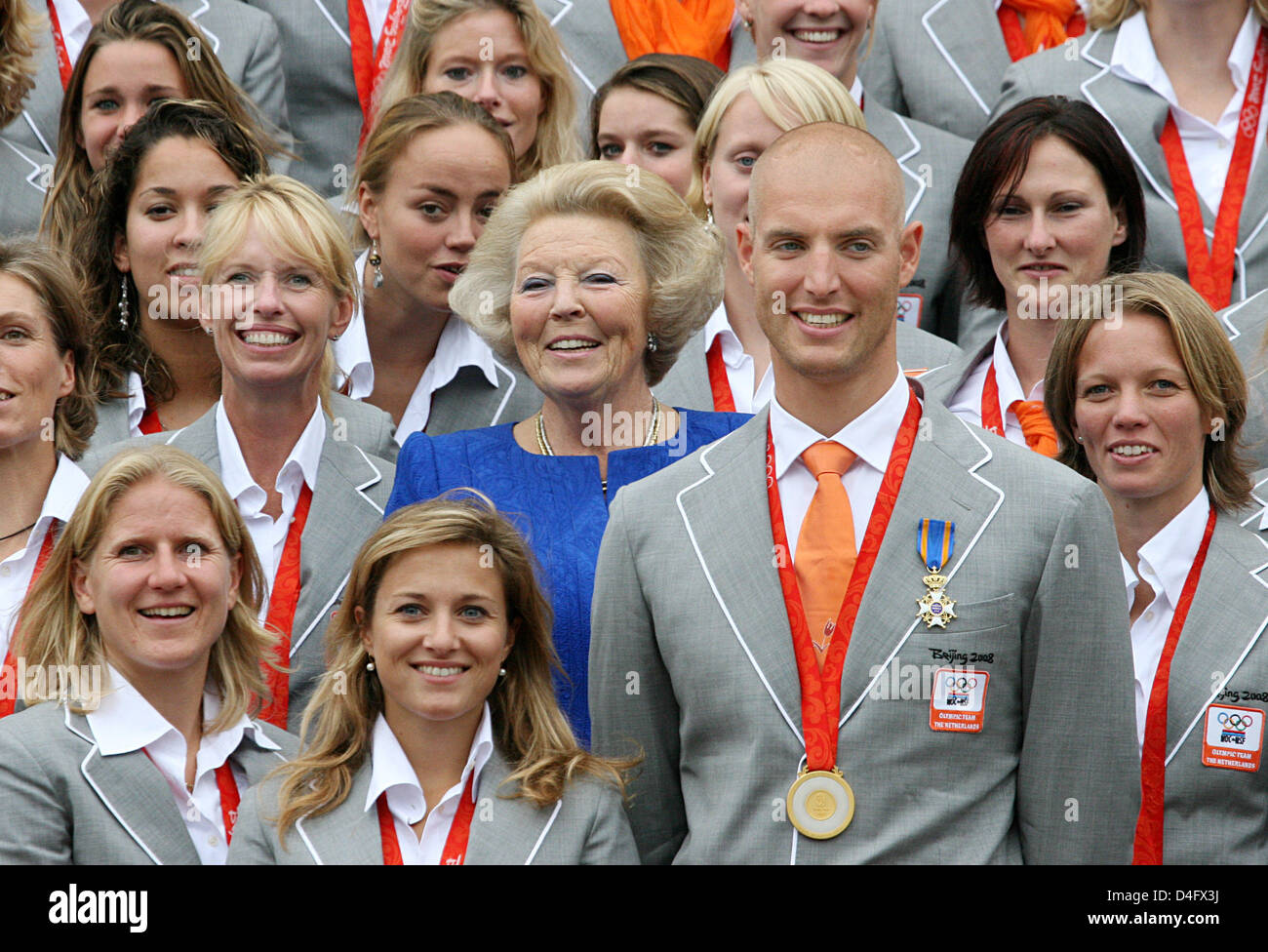 Dutch Queen Beatrix (C) poses for a group picture with athletes as she ...