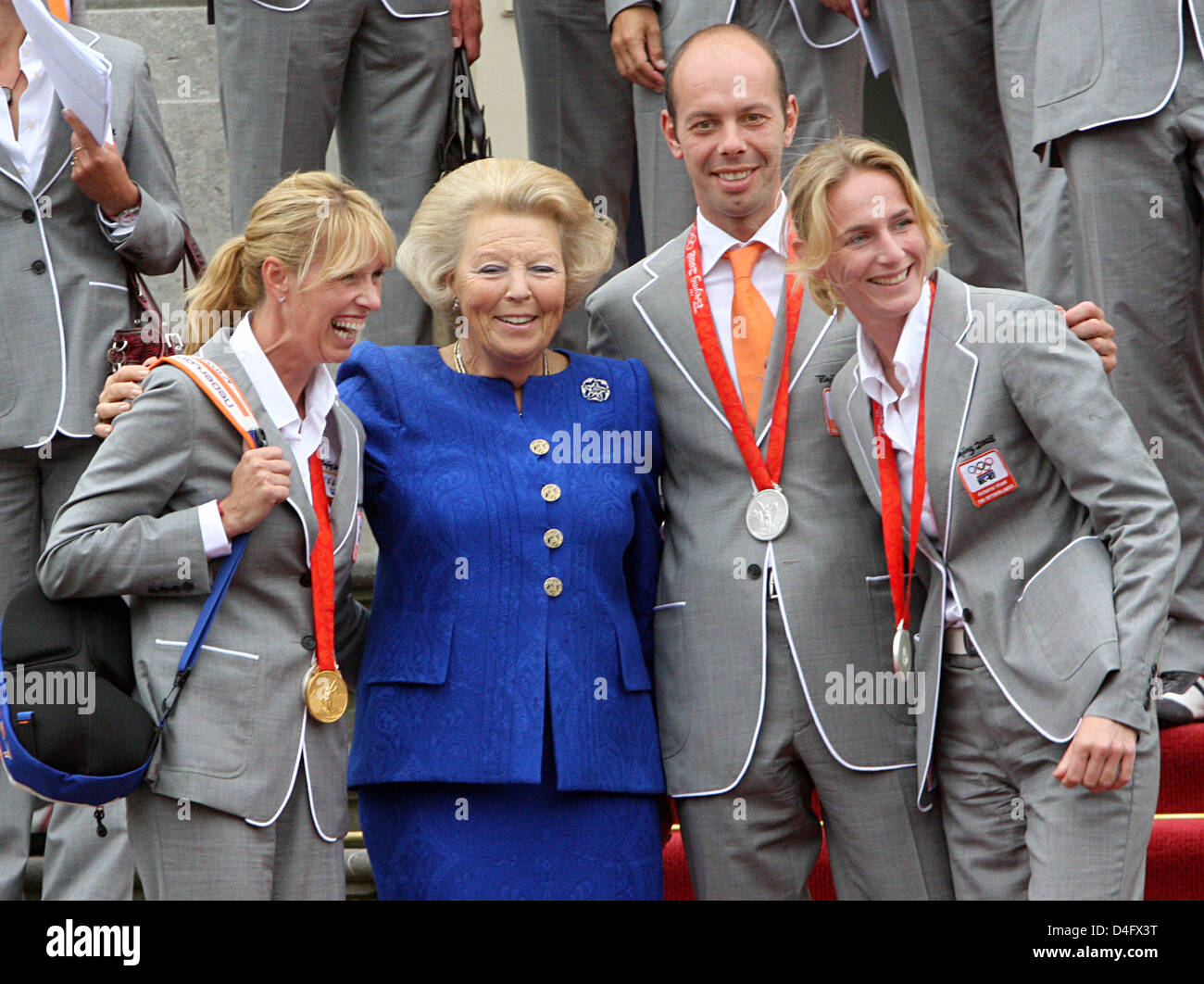 Dutch Queen Beatrix (C) poses for a group picture with athletes as she ...