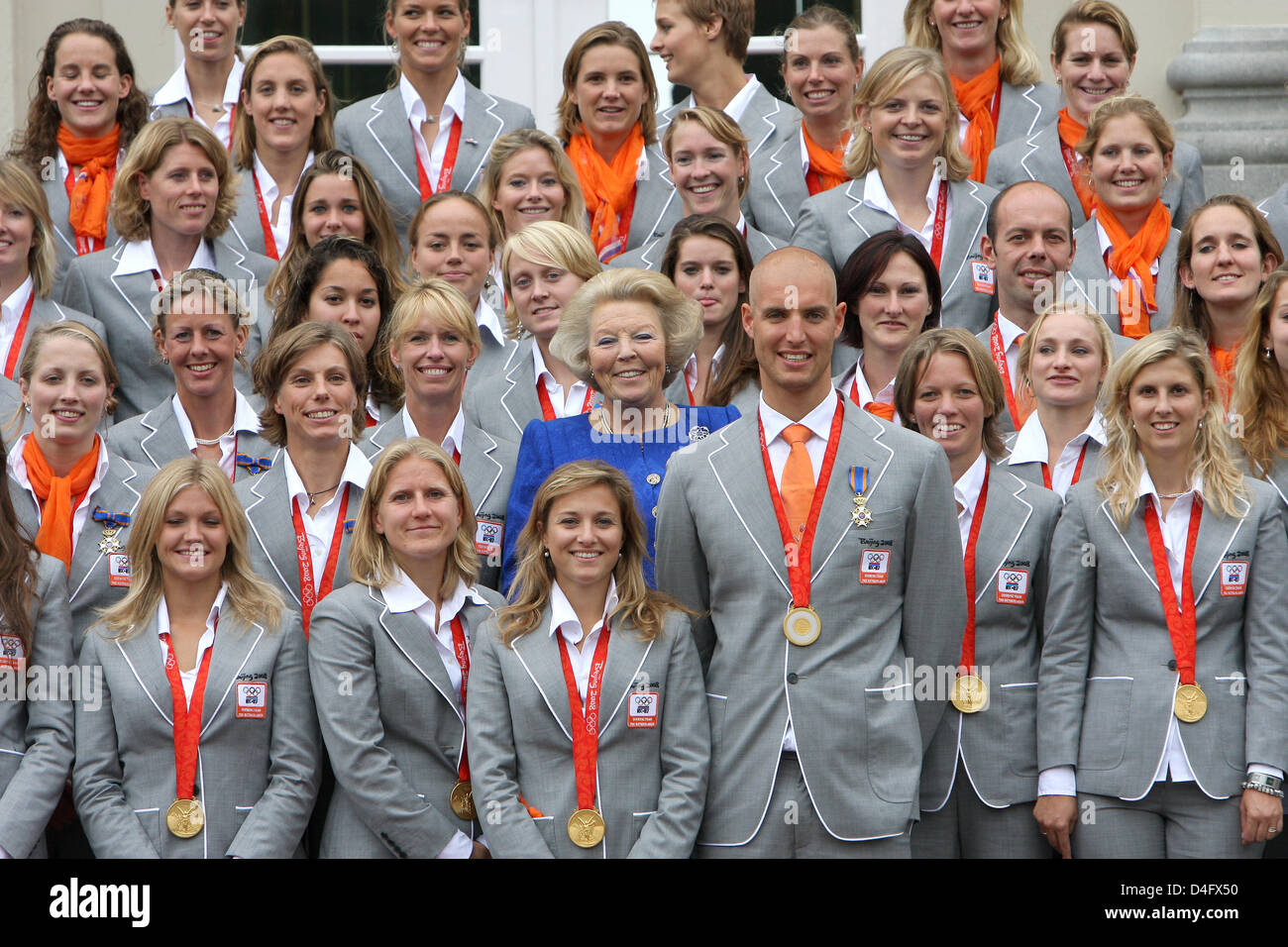Dutch Queen Beatrix (C) poses for a group photo with athletes as she ...