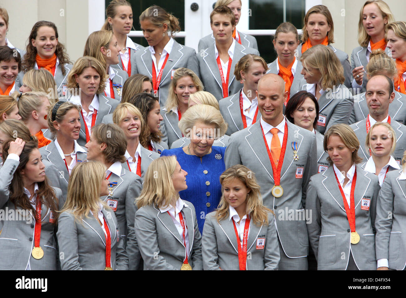 Dutch Queen Beatrix (C) poses for a group photo with athletes as she ...
