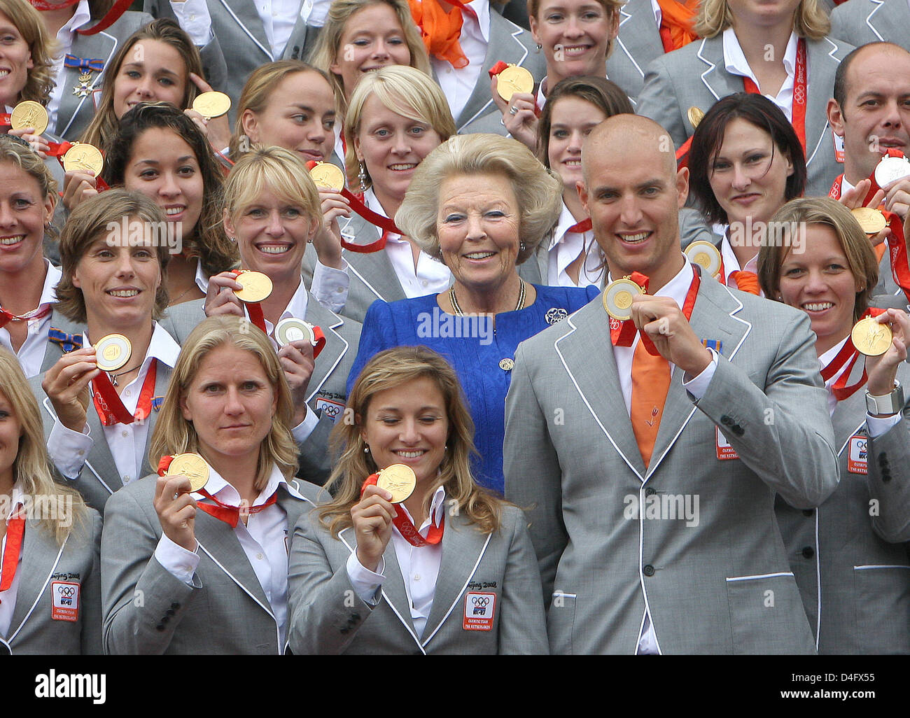 Dutch Queen Beatrix (C) poses for a group photo with athletes as she ...