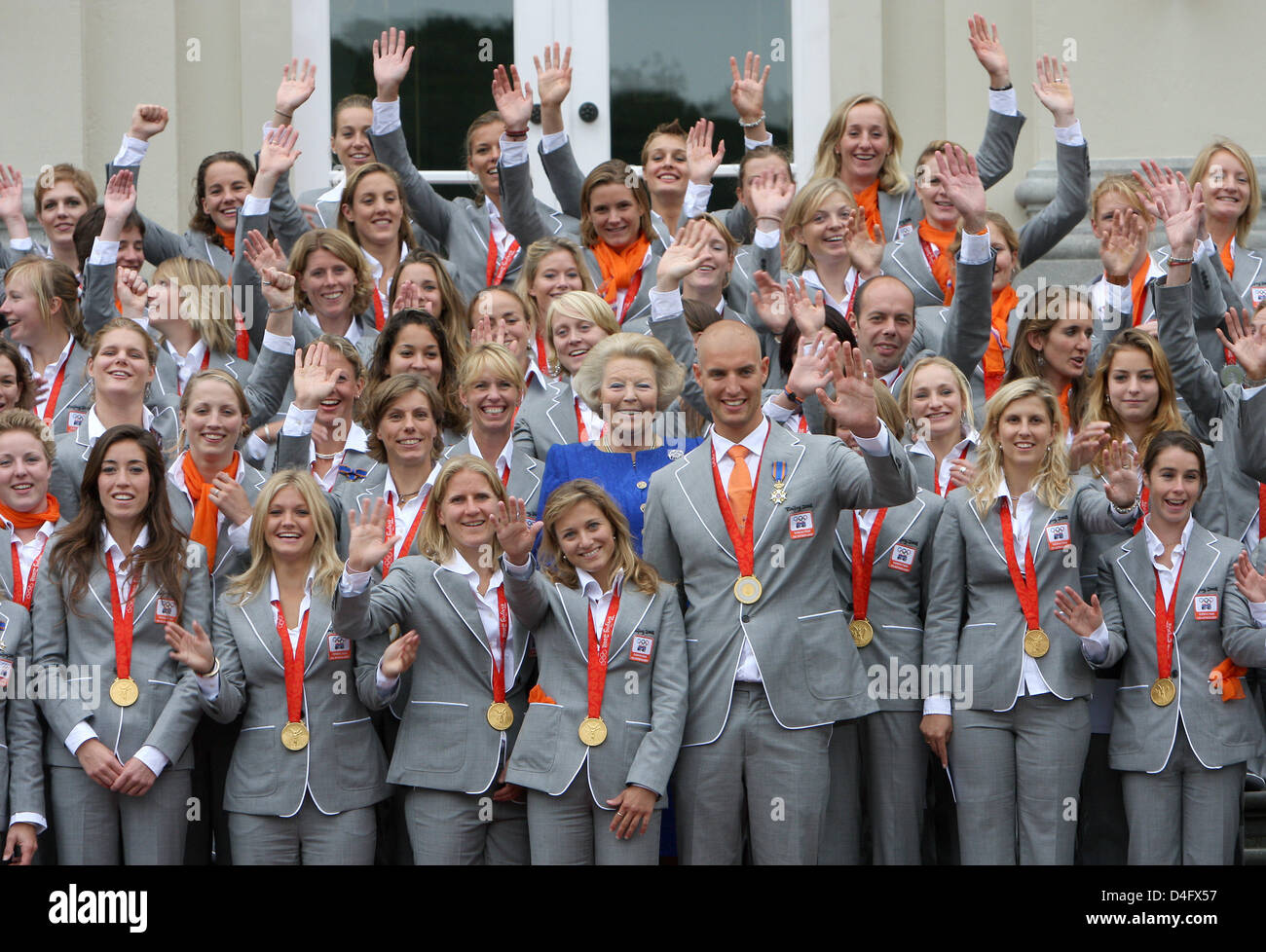 Dutch Queen Beatrix (C) poses for a group photo with athletes as she ...