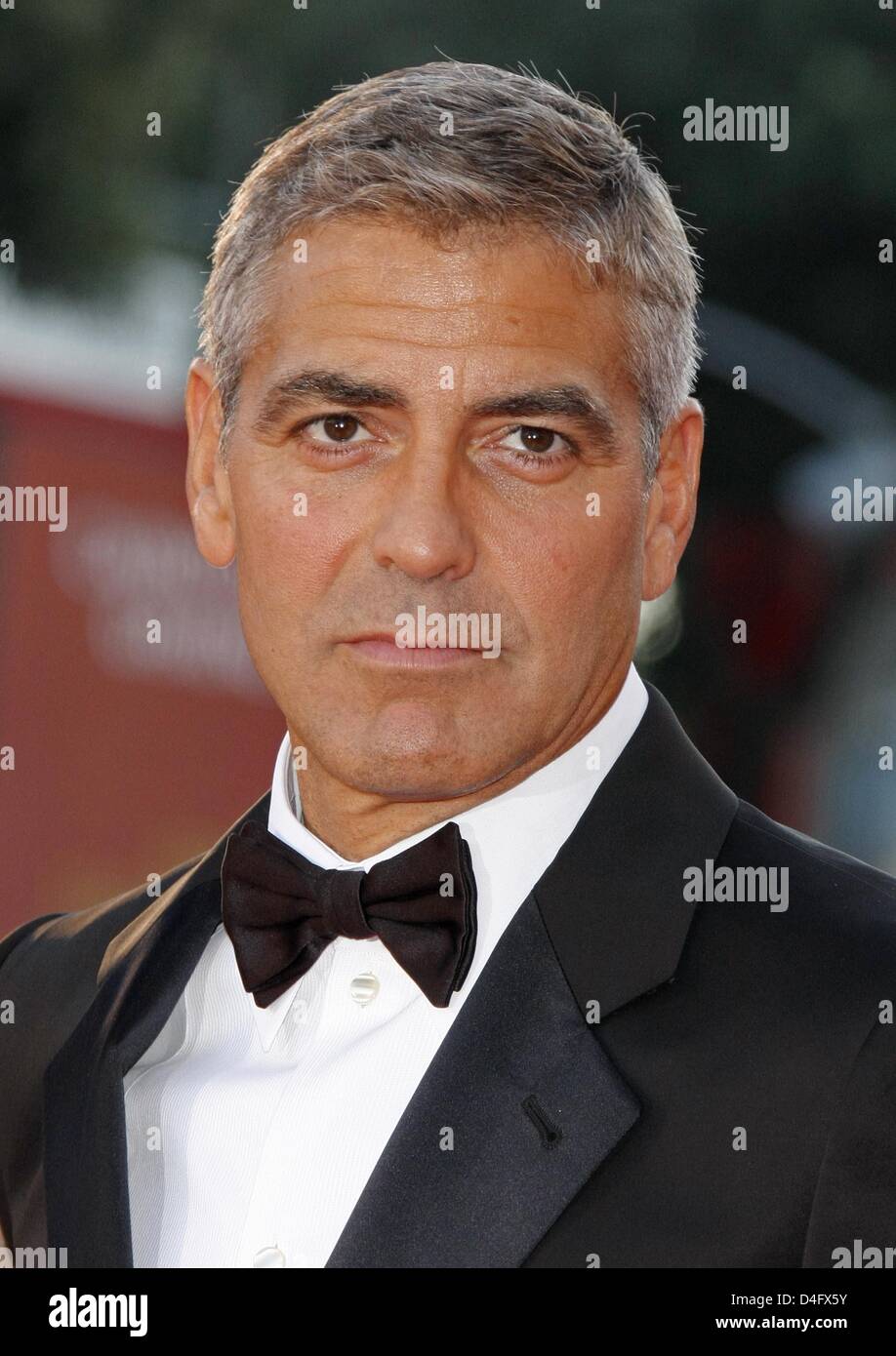 Actor George Clooney attends the opening night screening for the movie ...