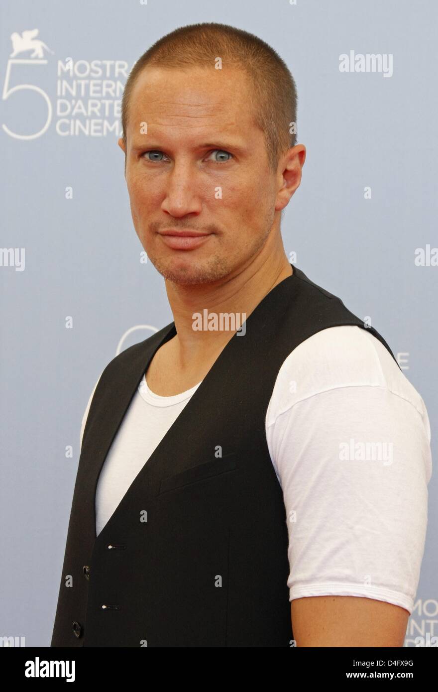 German actor Benno Fuermann poses for photographers after a press ...