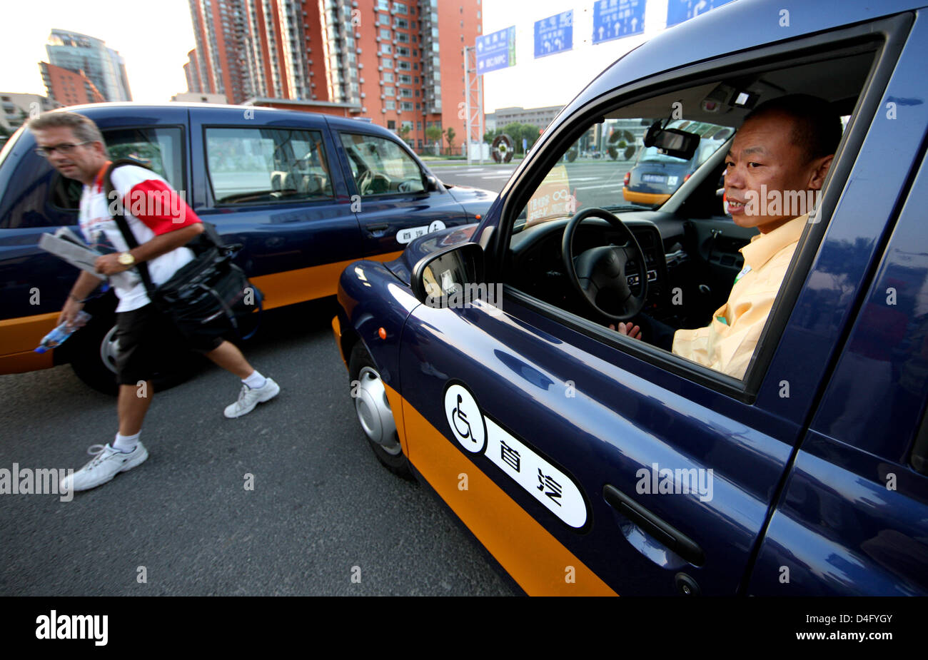 Taxi driver Liu Yeushen drives his taxi for disabled in Beijing, China ...