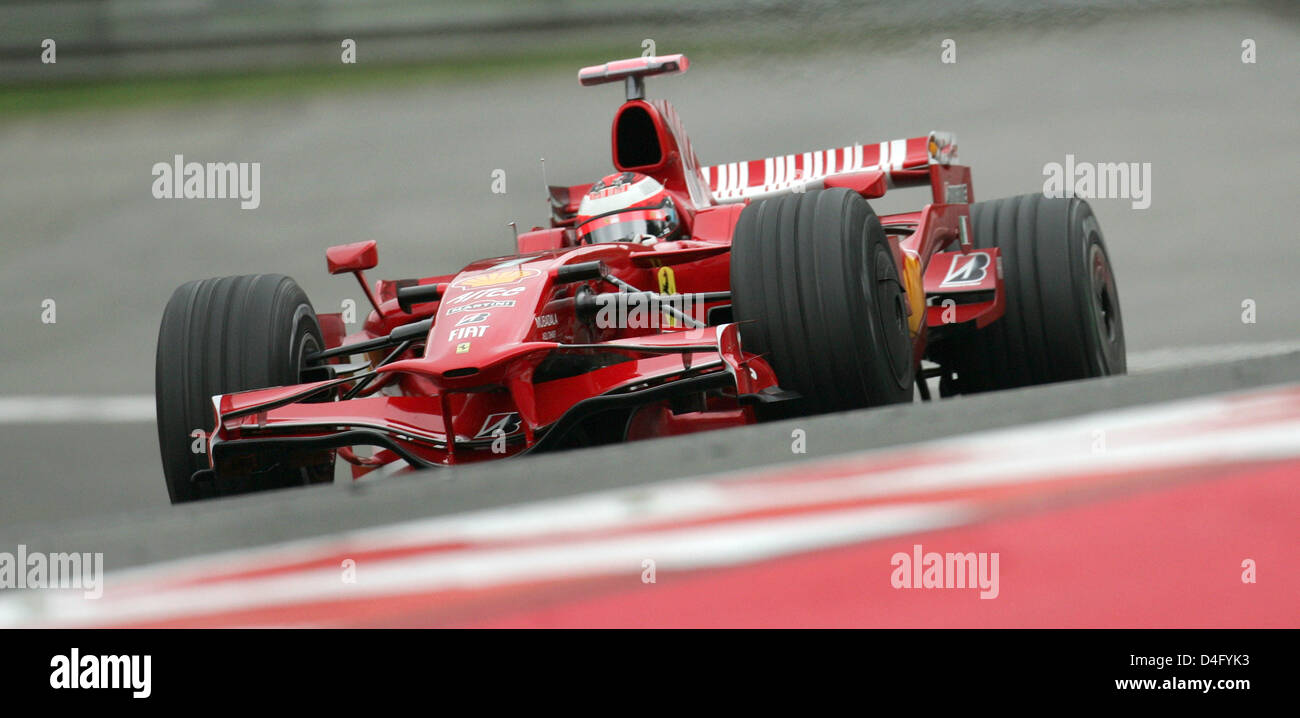 Finnish Formula One driver Kimi Raikkonen of Scuderia Ferrari comes ...