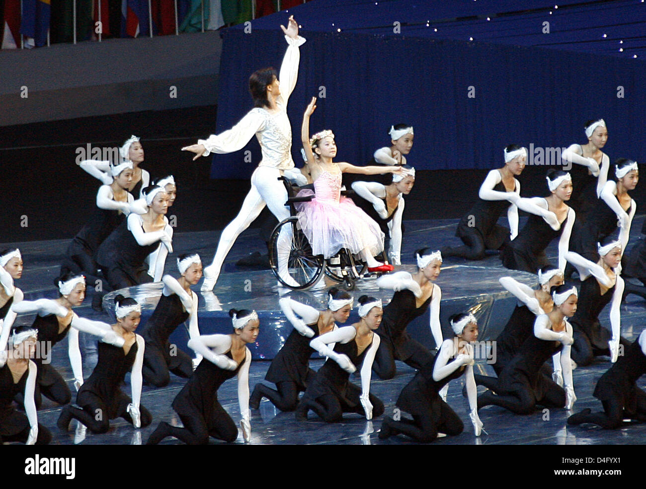 Chinese ballet dancer Li Yue (top) dances during the opening ceremony ...