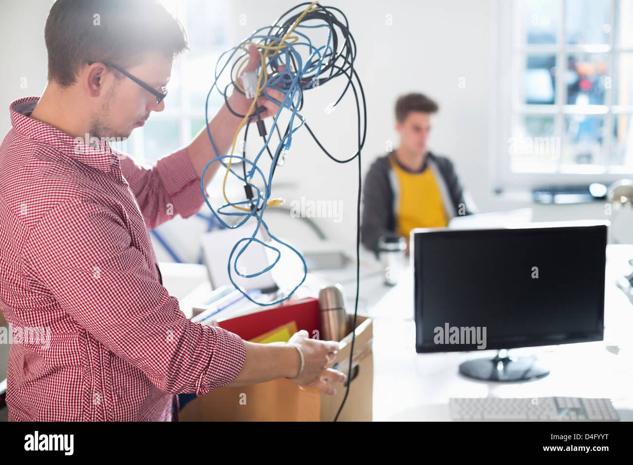 Untangling cable hi-res stock photography and images - Alamy