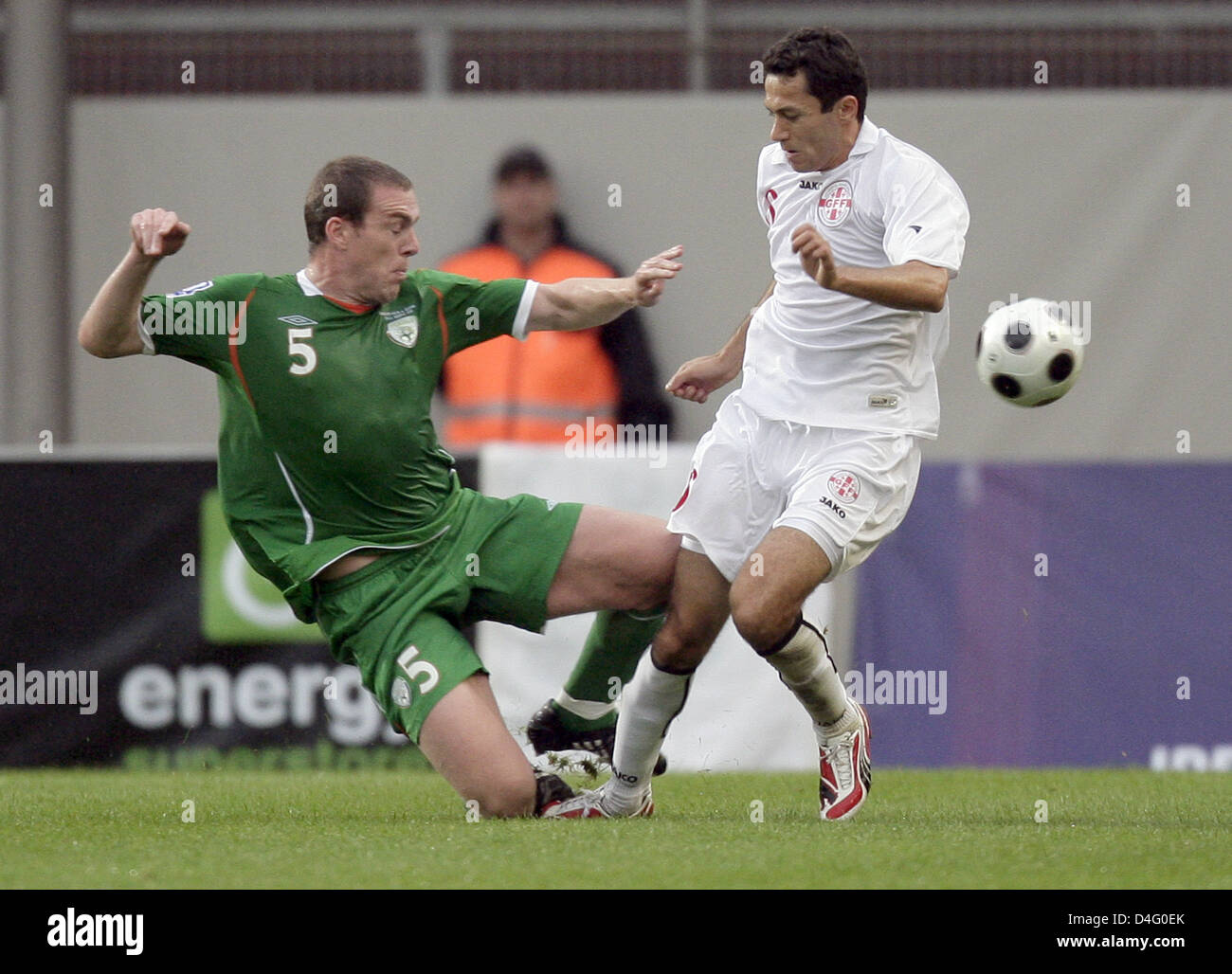 Georgia's George Shashiashvili (R) fights for the ball against Irish ...