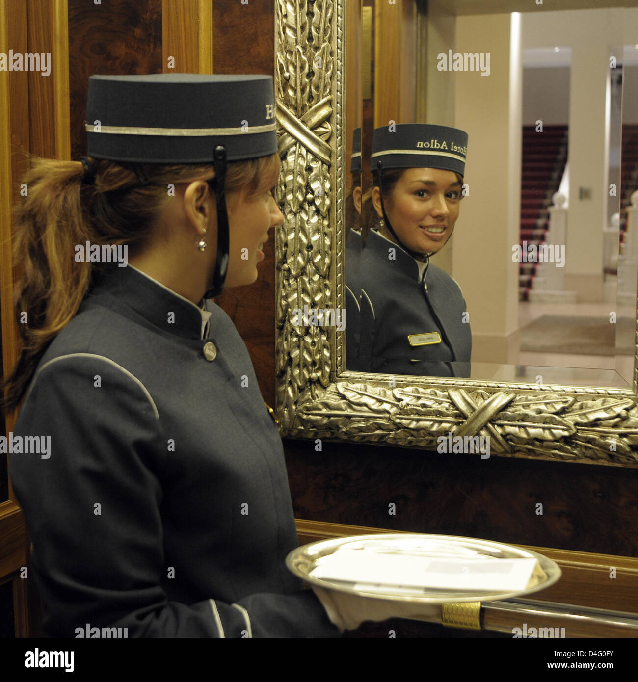 Female hotel porter Joanna Dziersk (21) is pictured at Hotel Adlon in ...