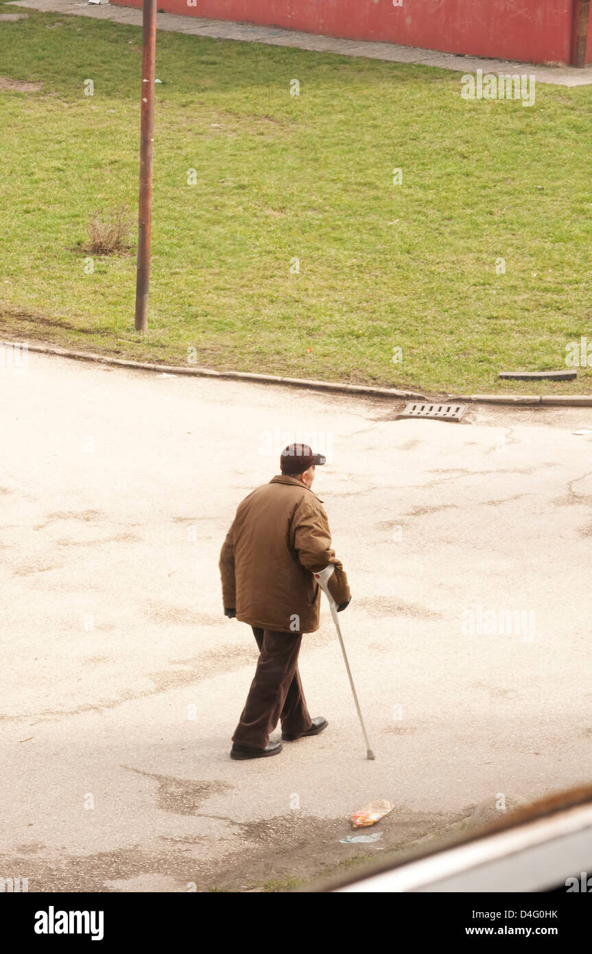 Old man with crutch hi-res stock photography and images - Alamy