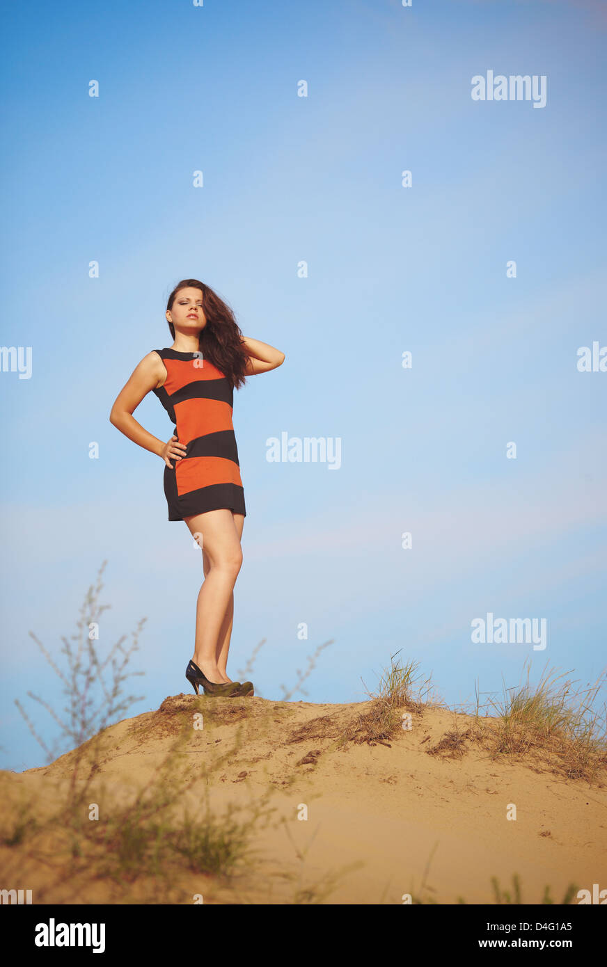 Girl on sand Stock Photo - Alamy
