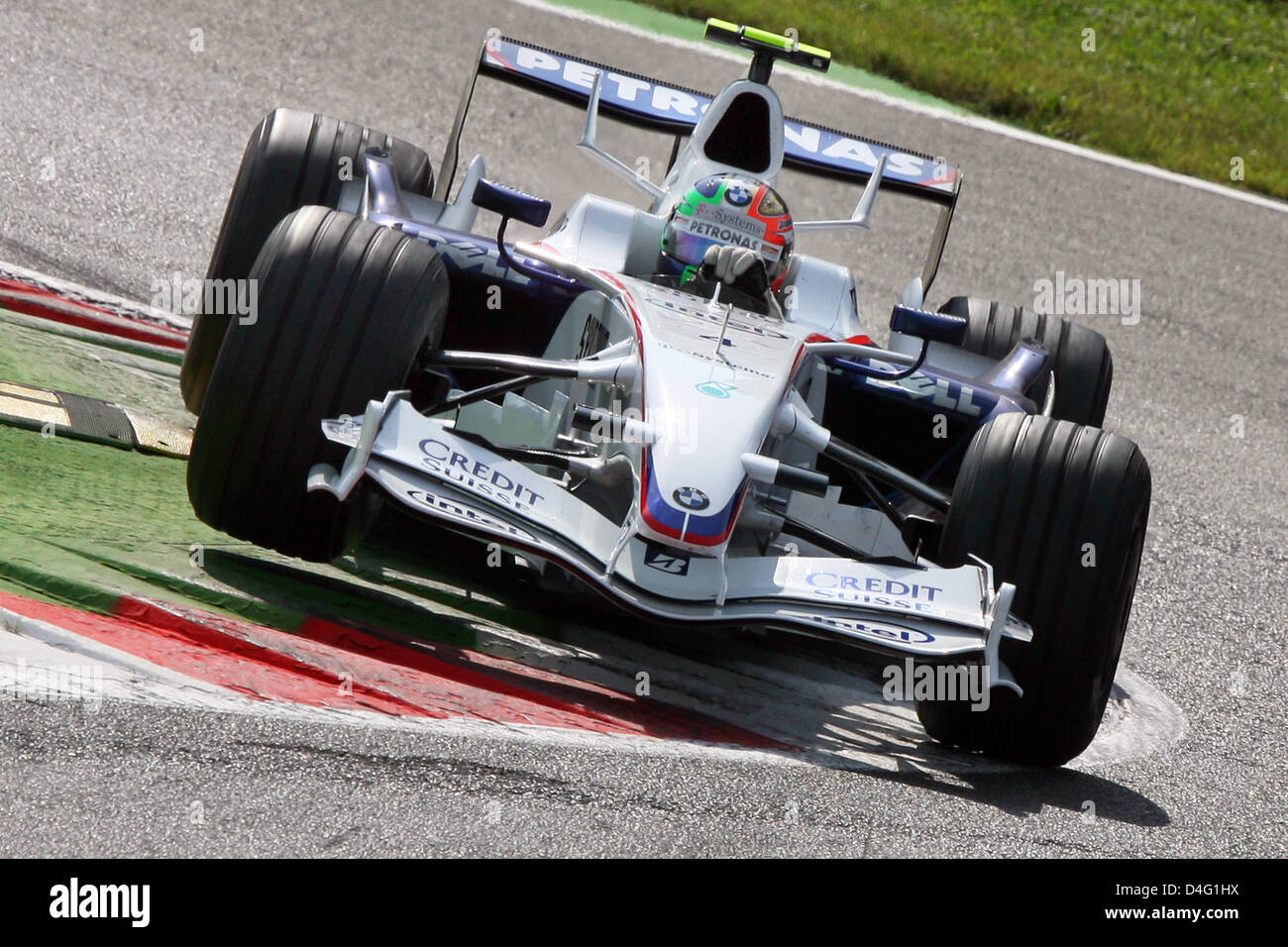 Polish Formula One driver Robert Kubica of BMW Sauber cuts the first ...