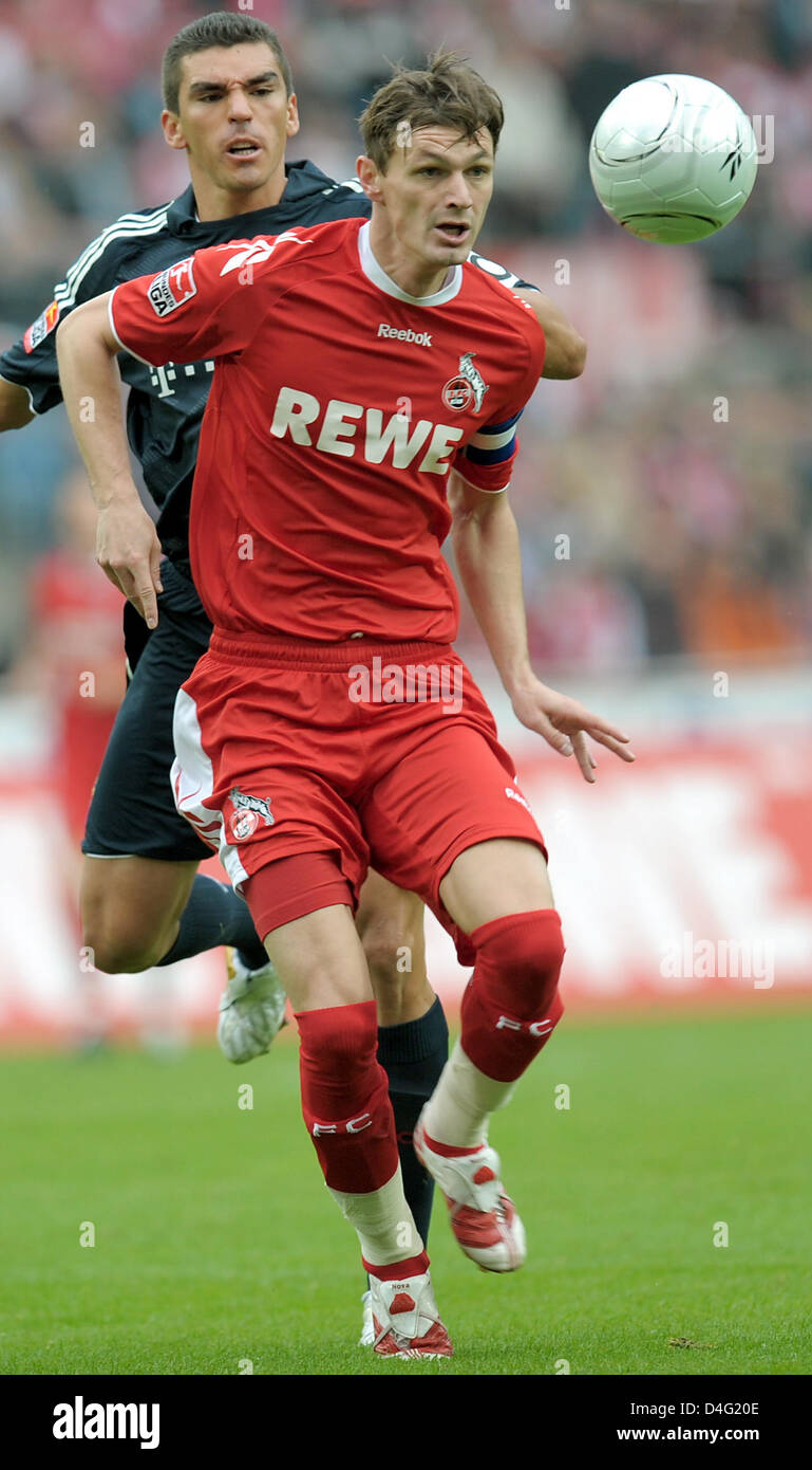 Munich's Lucio (back) and Cologne's Milivoje Novakovic (front) in the ...