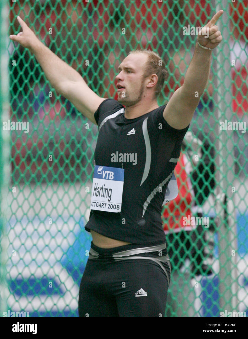 German discus thrower Robert Harting celebrates his 65.76m attempt at ...