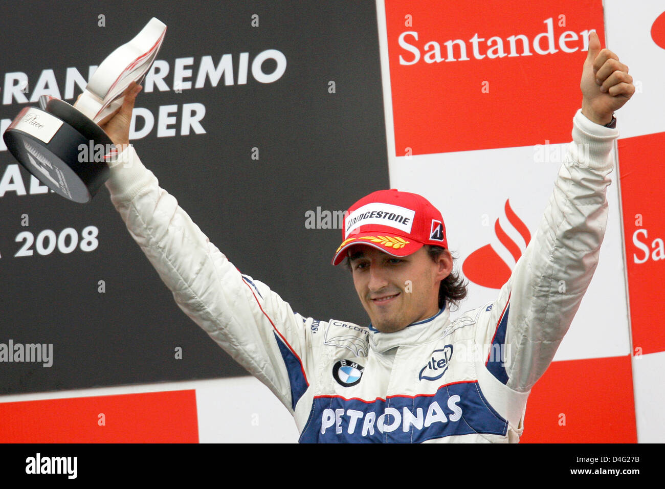 Polish Formula One driver Robert Kubica of BMW Sauber celebrates his ...