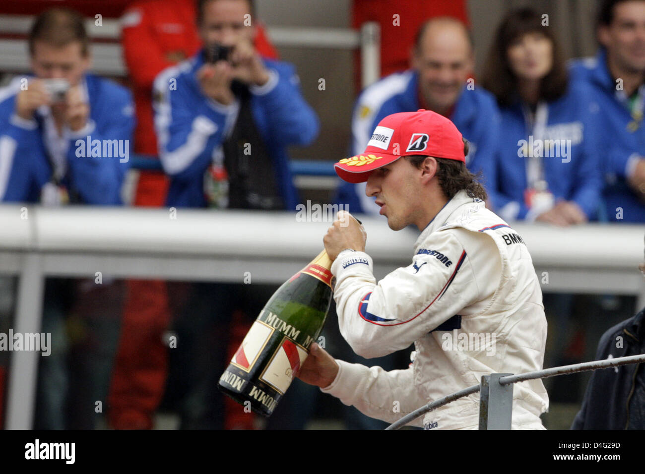 Polish Formula One driver Robert Kubica of BMW Sauber celebrates on the ...