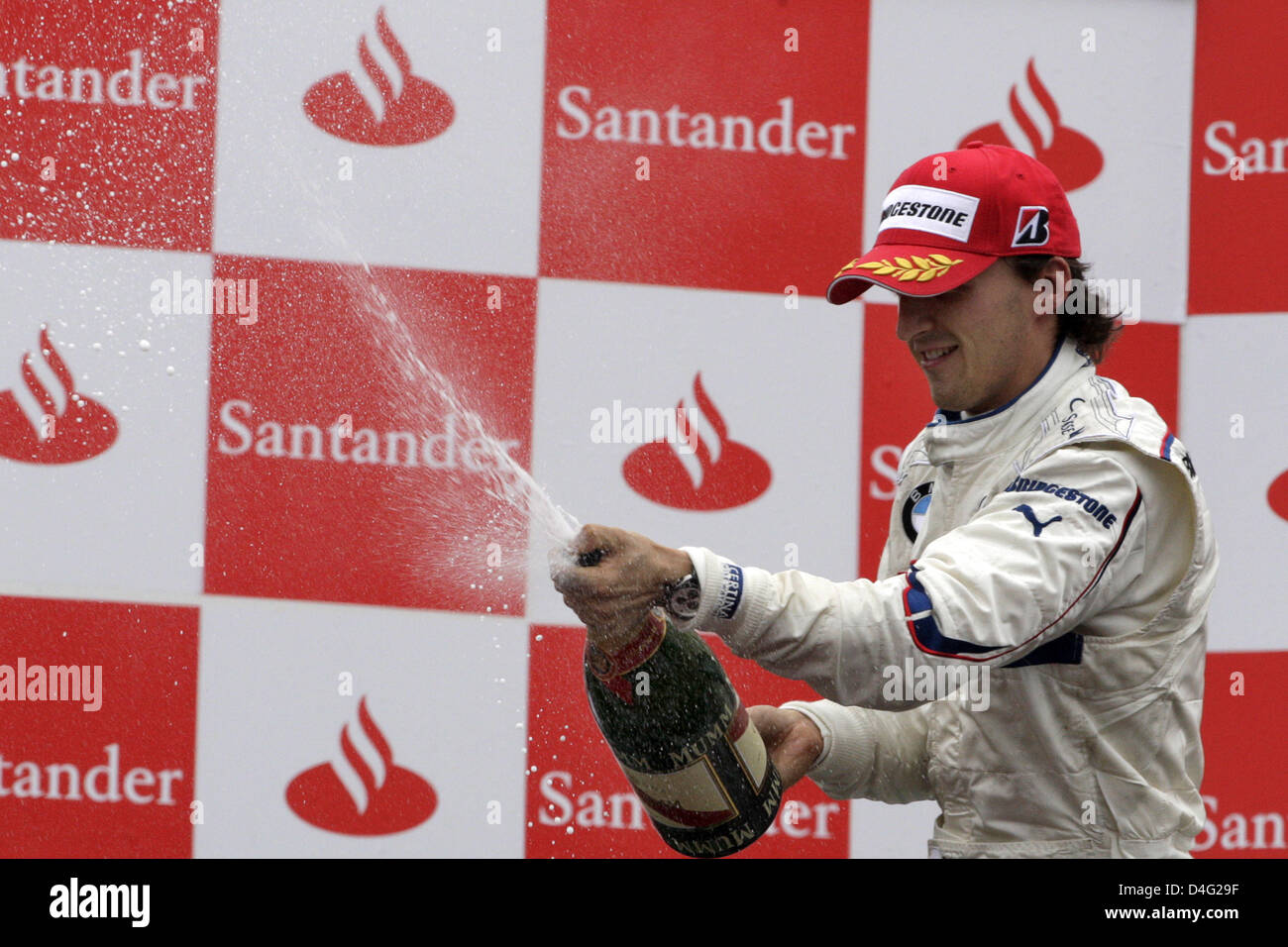 Polish Formula One driver Robert Kubica of BMW Sauber celebrates on the ...