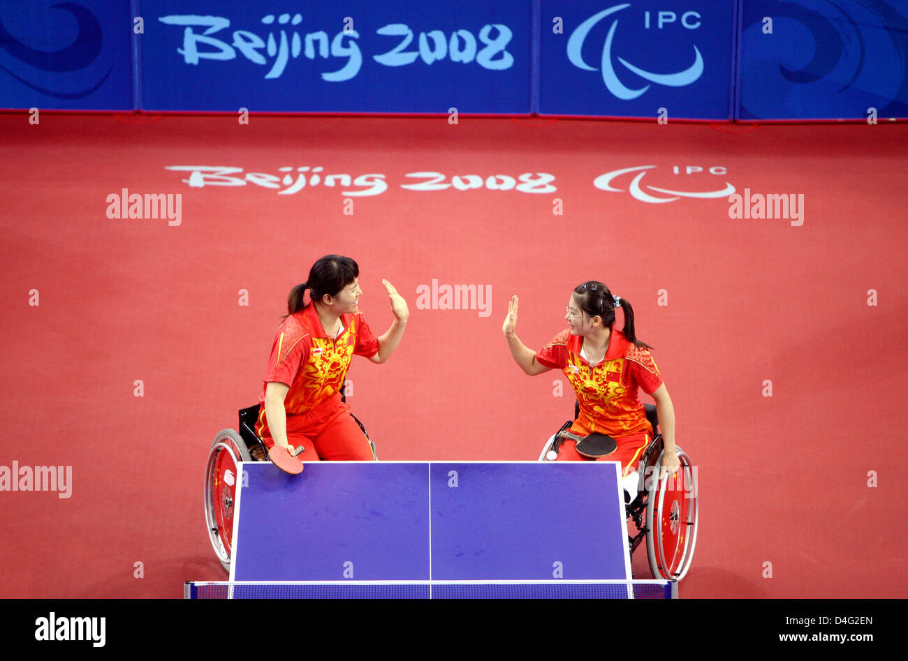 Chinese table tennis players Gai Gu (R) and Guixiang Ren face German ...