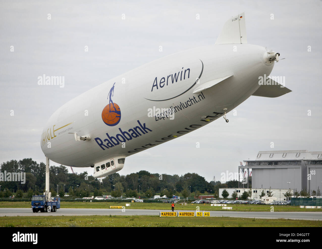 An airship (LZ N07) is pulled across an Airbus airfield in Hamburg ...